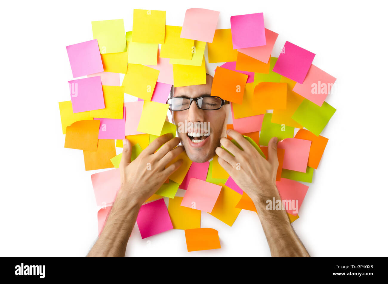 Man's face through paper and reminders Stock Photo - Alamy