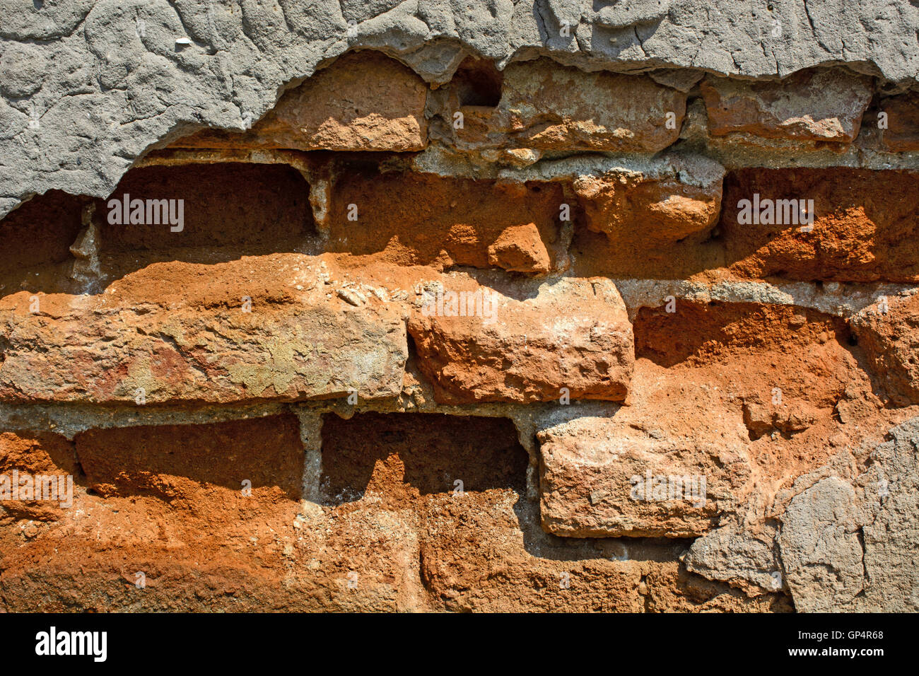 Home cracked old dilapidated brick wall Stock Photo - Alamy