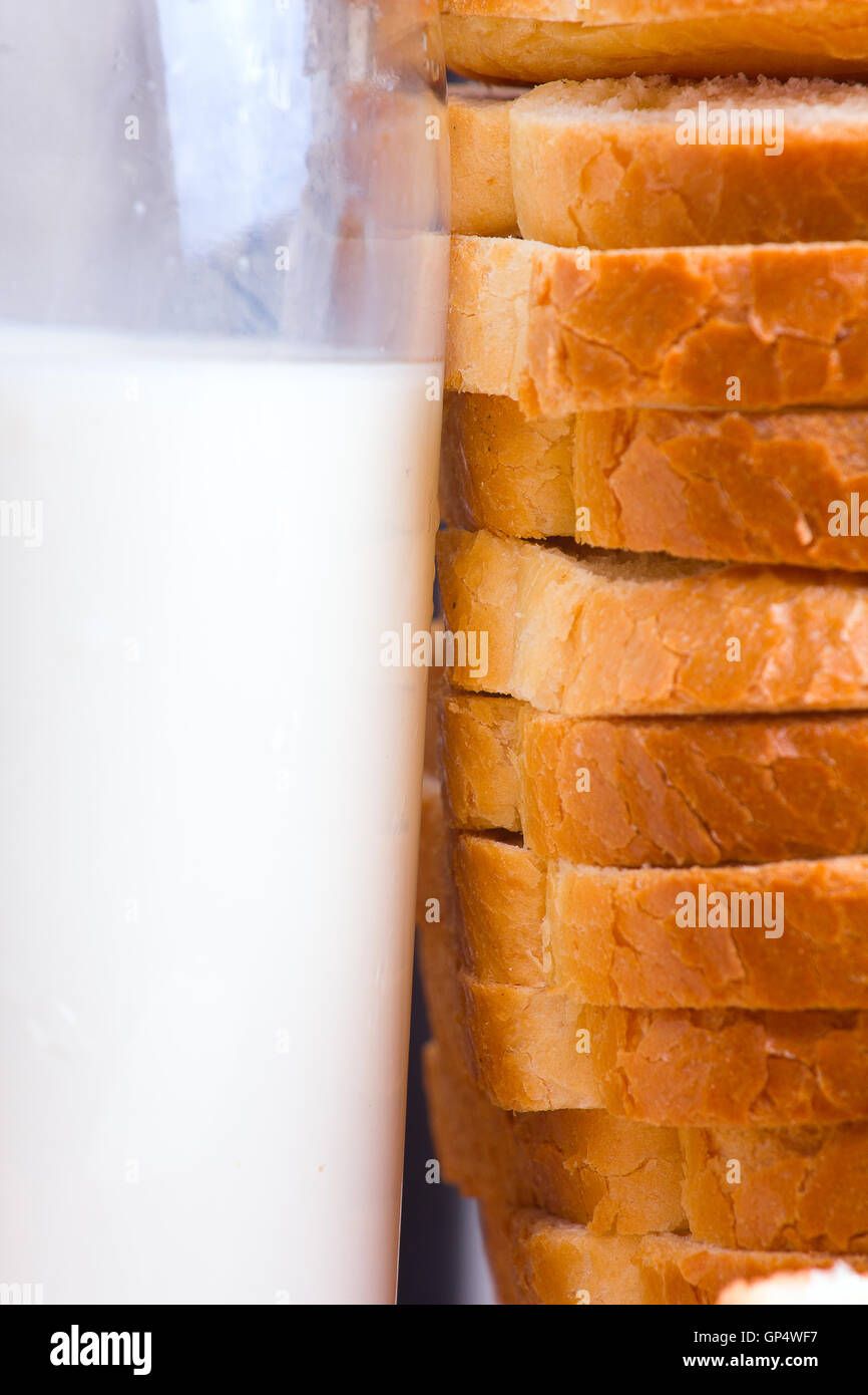 milk and lots of fresh bread close Stock Photo - Alamy