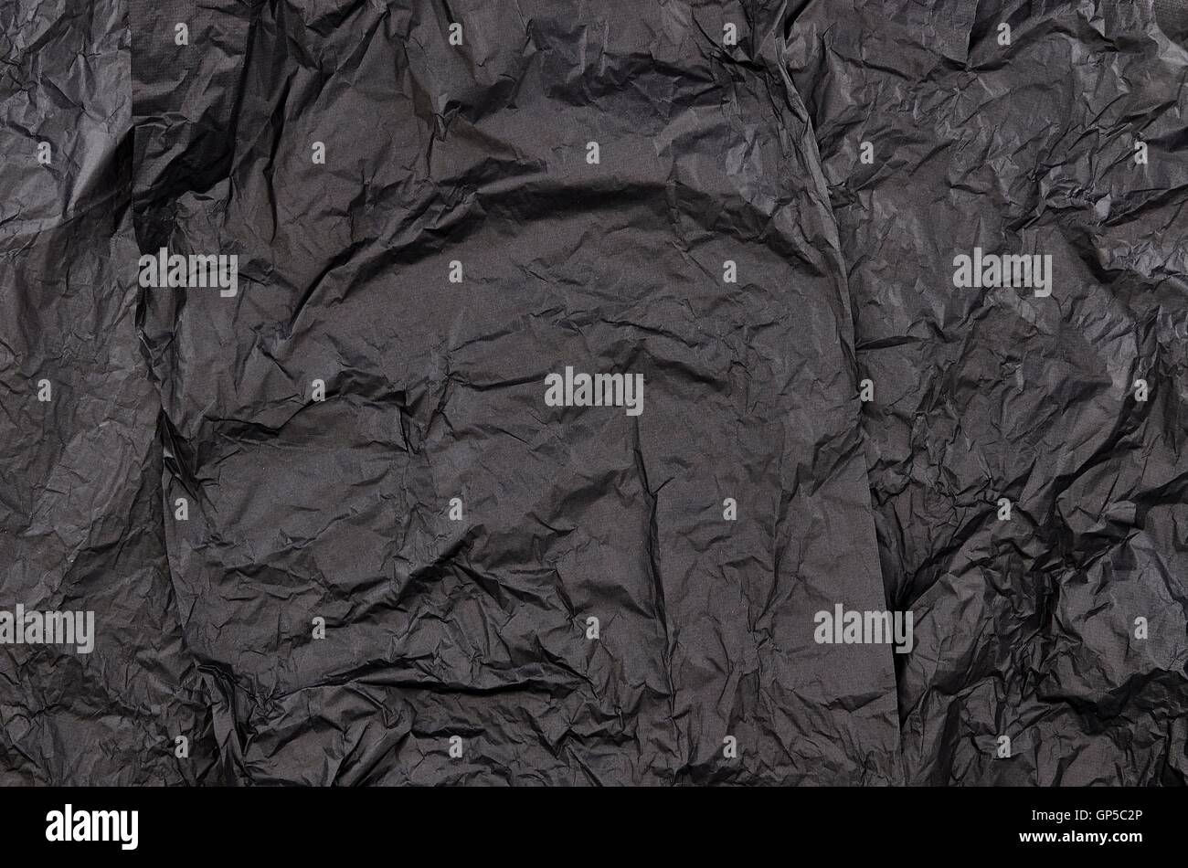 A studio photo of black wrapping paper Stock Photo - Alamy