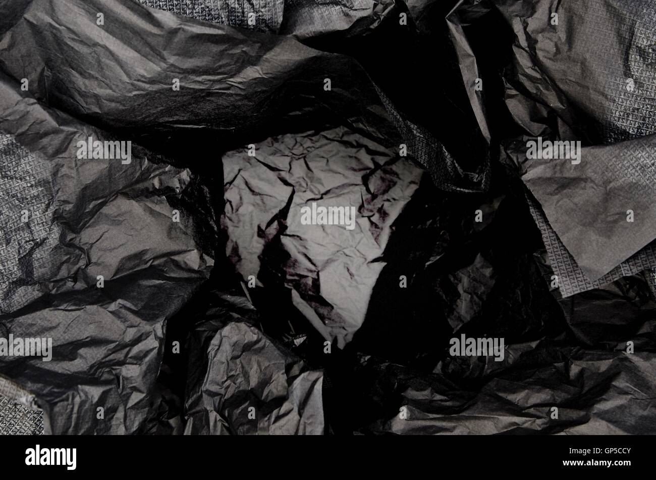 A studio photo of black wrapping paper Stock Photo - Alamy