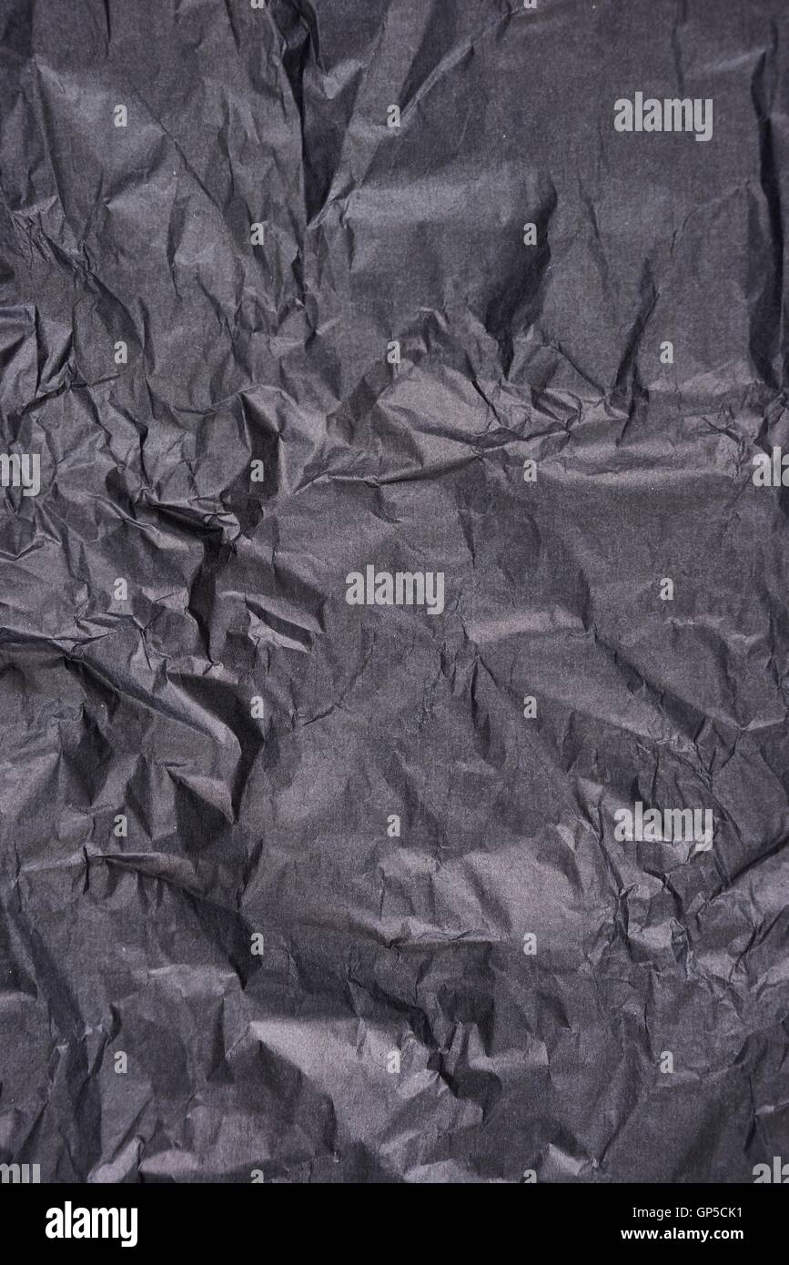 A studio photo of black wrapping paper Stock Photo - Alamy