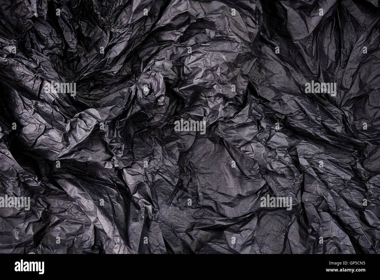 A studio photo of black wrapping paper Stock Photo - Alamy