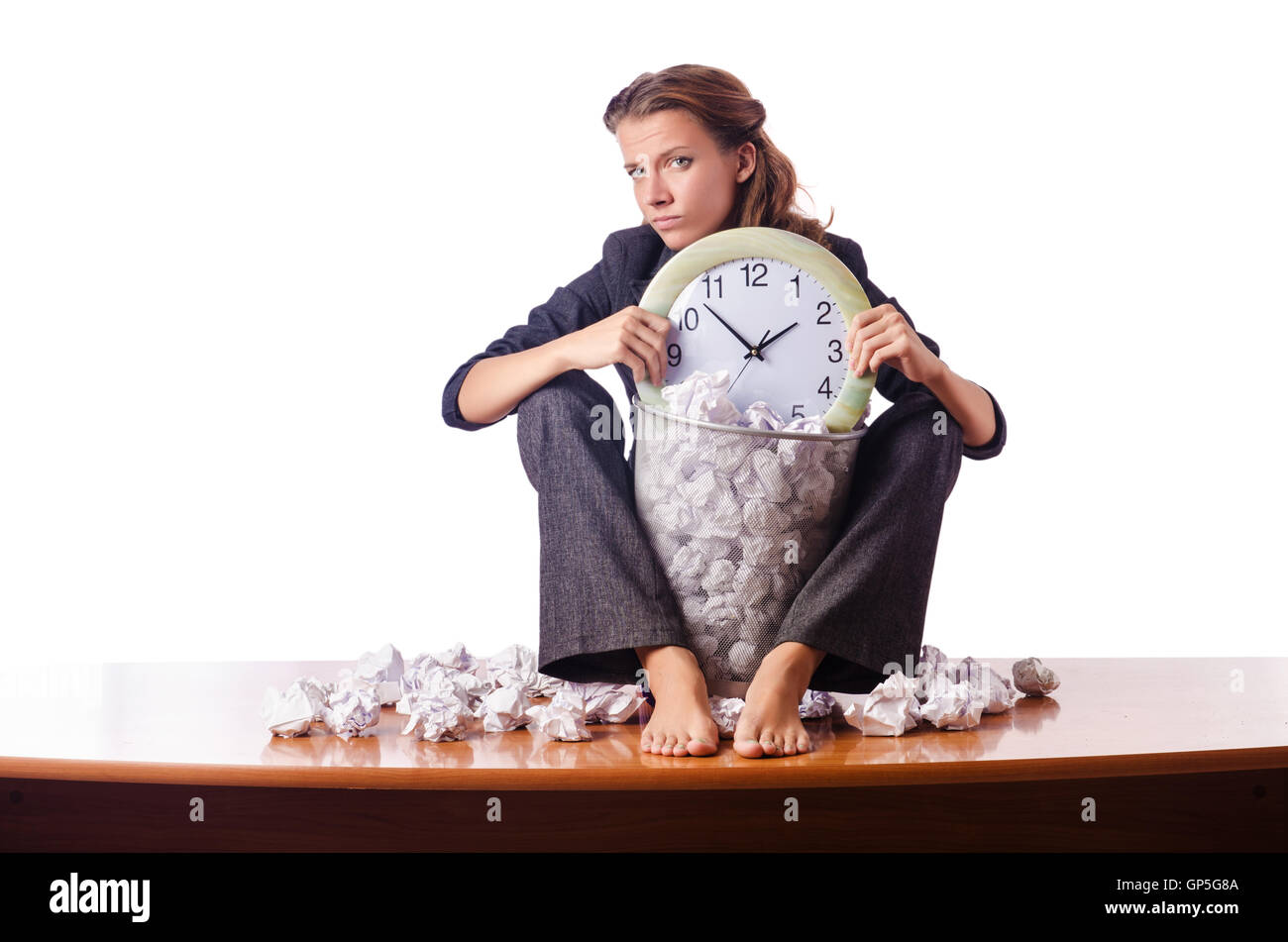Woman with lots of discarded paper Stock Photo - Alamy