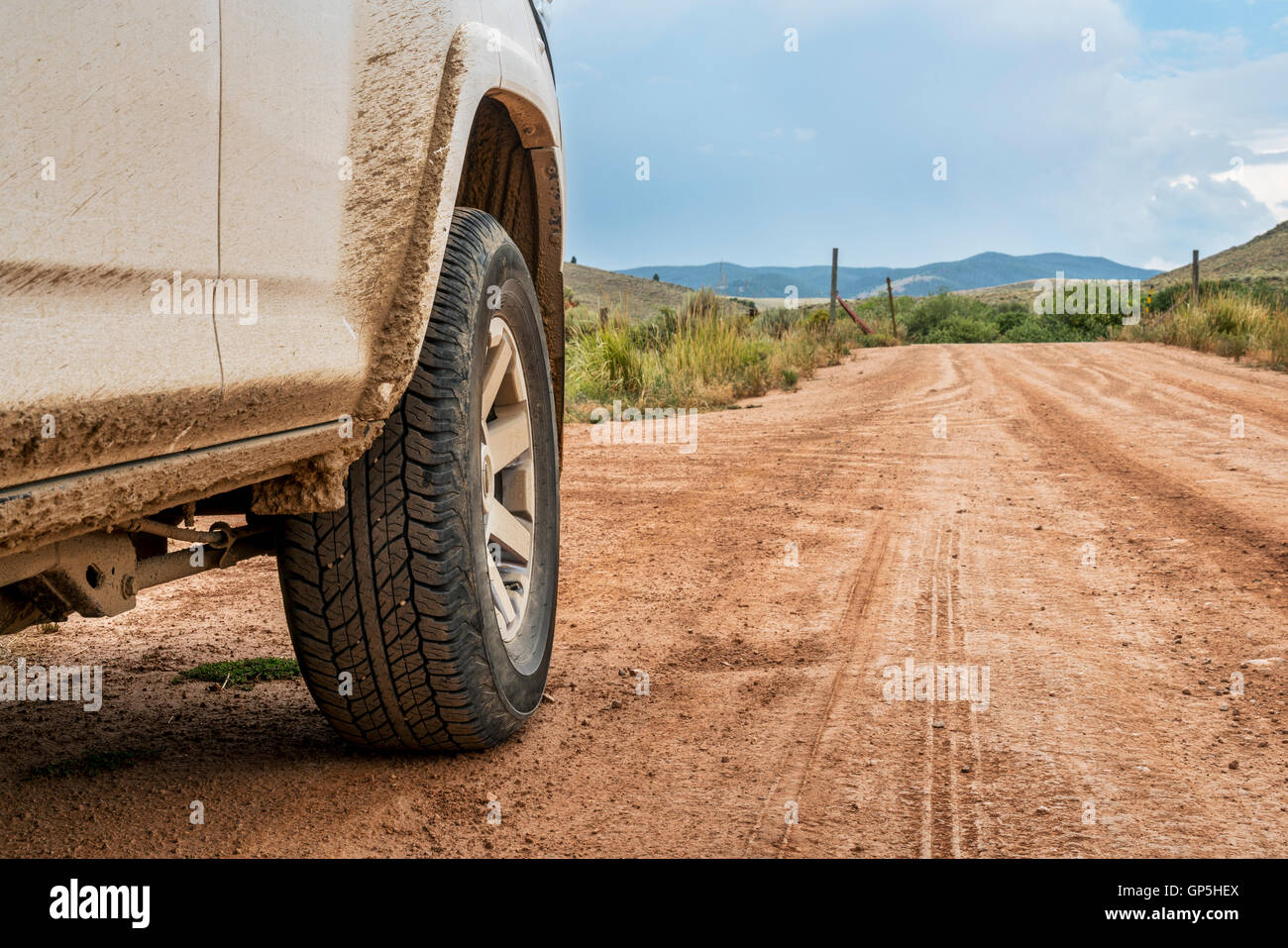Closeup of 4x4 SUV car driving on a dusty dirt road Stock Photo - Alamy