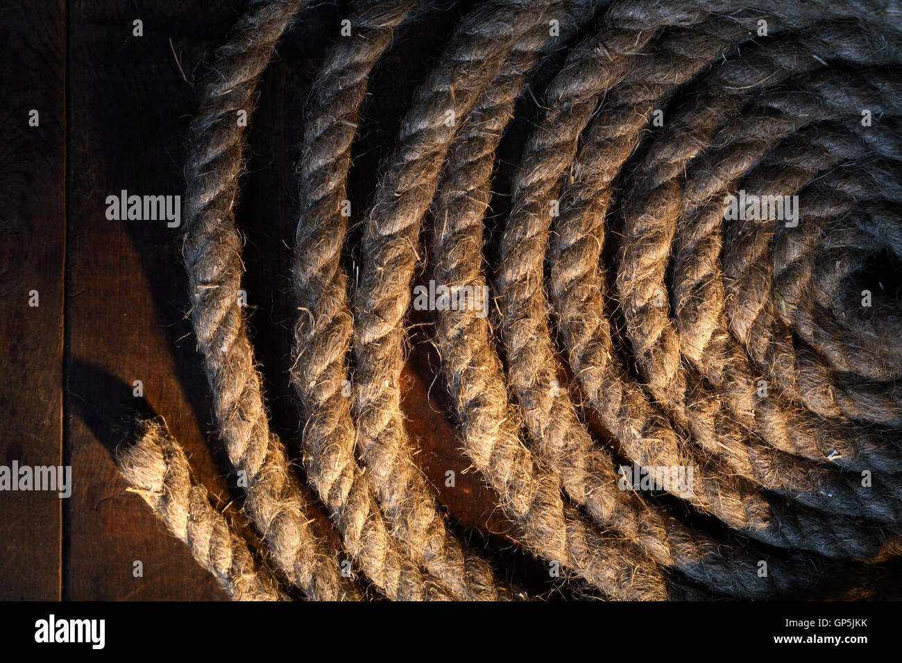 Rope On Wood Stock Photo - Alamy
