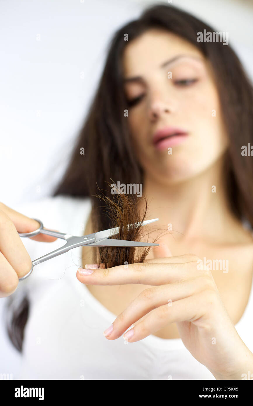 Woman cut long split ends hair Stock Photo - Alamy