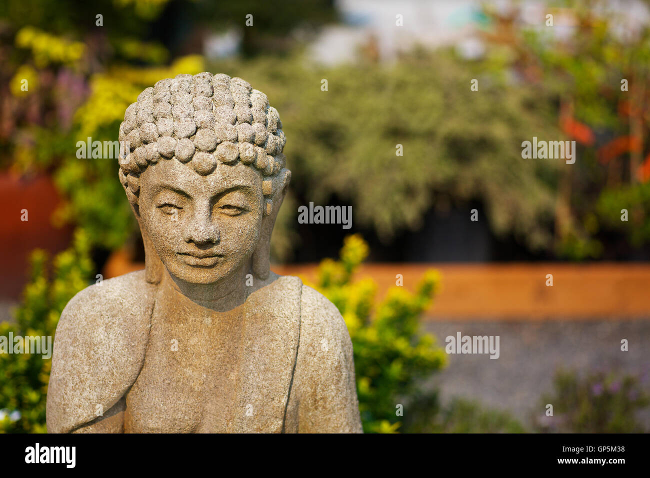 Shallow focus Buddha garden Stock Photo - Alamy