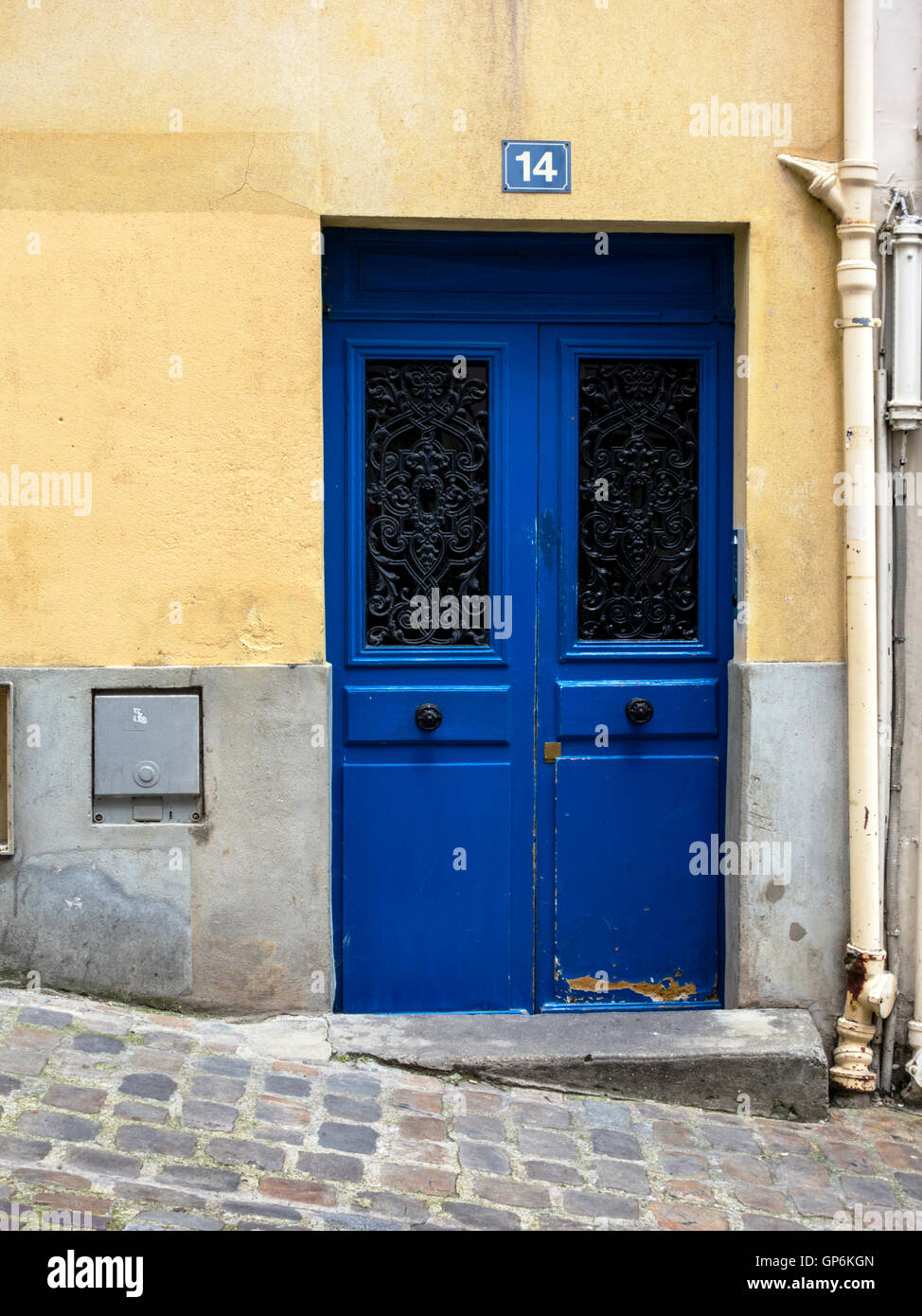 Blue door in Paris Stock Photo - Alamy