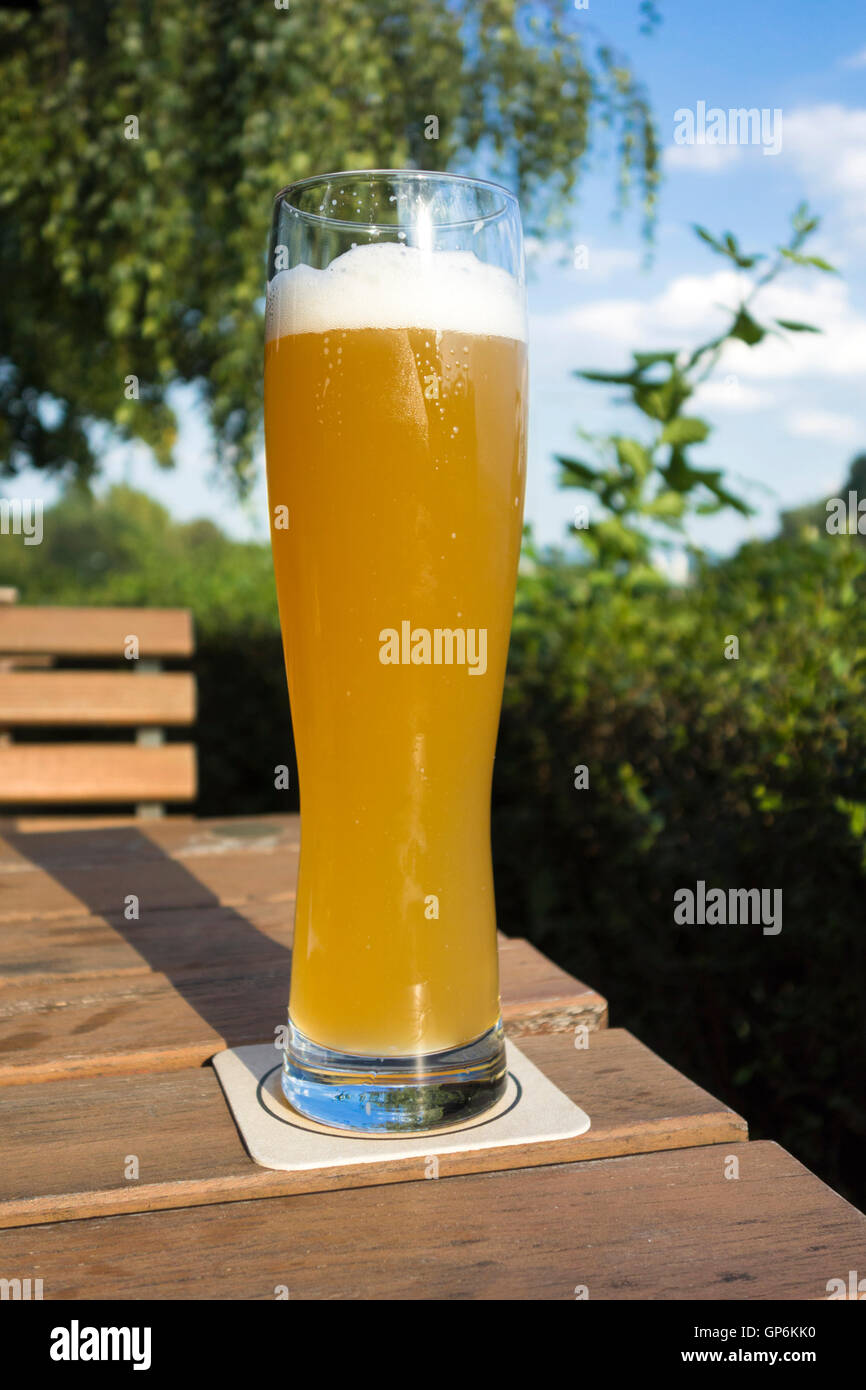 German wheat beer on a table outside Stock Photo - Alamy