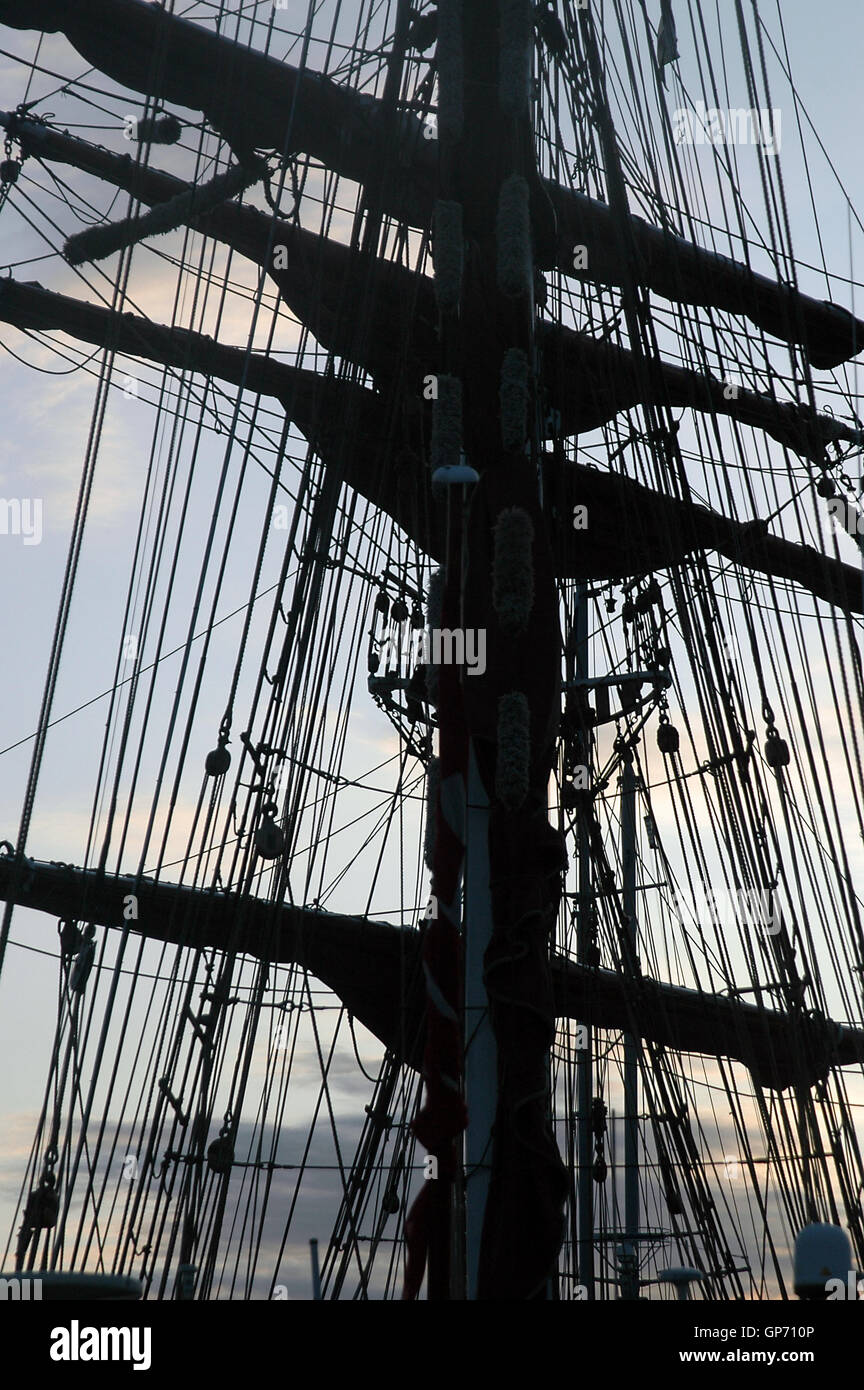 The mast of a tall sail ship with many ropes. Haul the right one! Stock ...