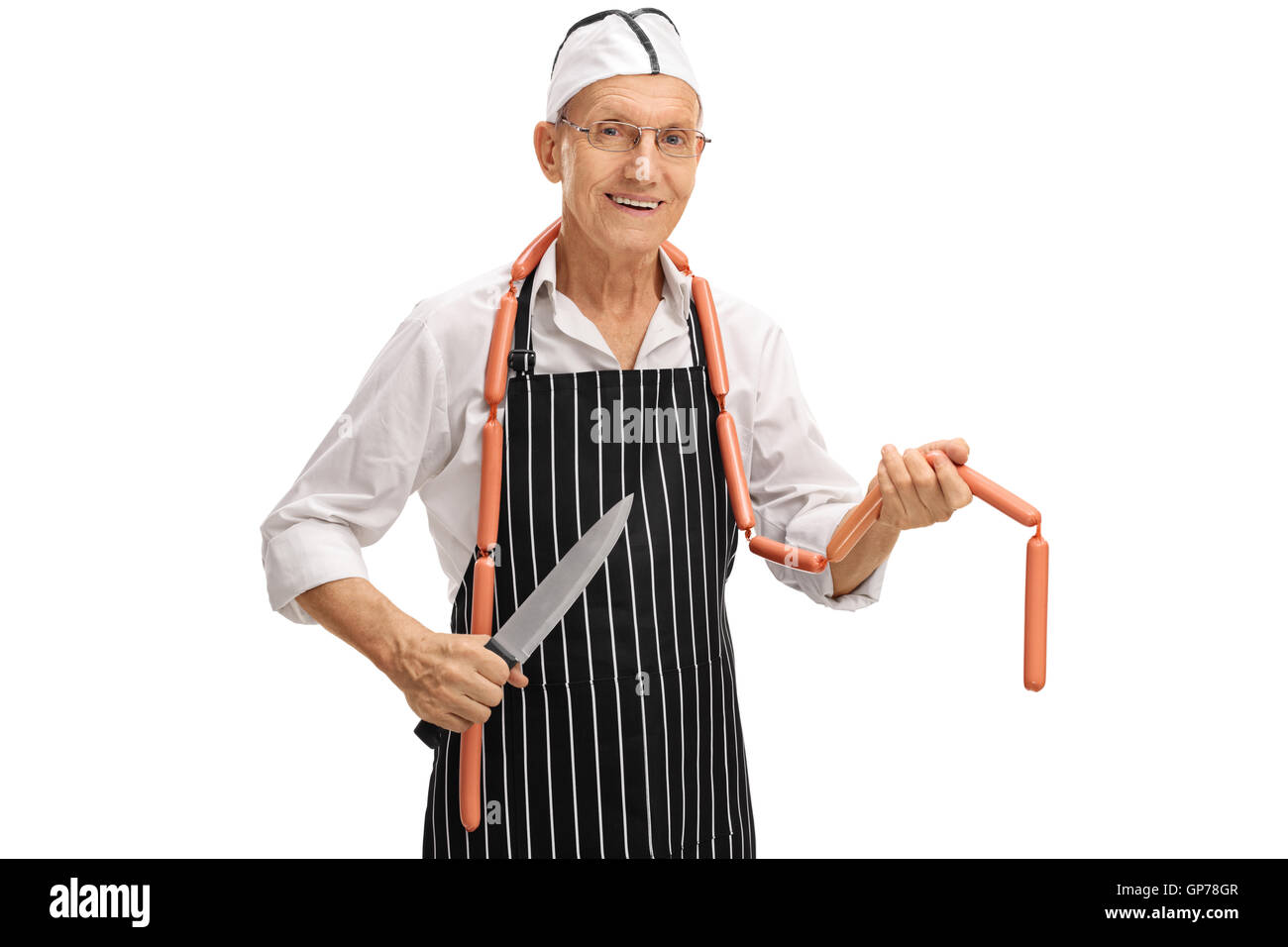Elderly butcher posing with a knife and sausages isolated on white ...