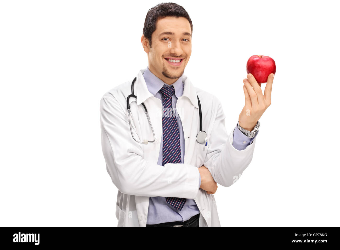 Smiling doctor holding an apple isolated on white background Stock ...