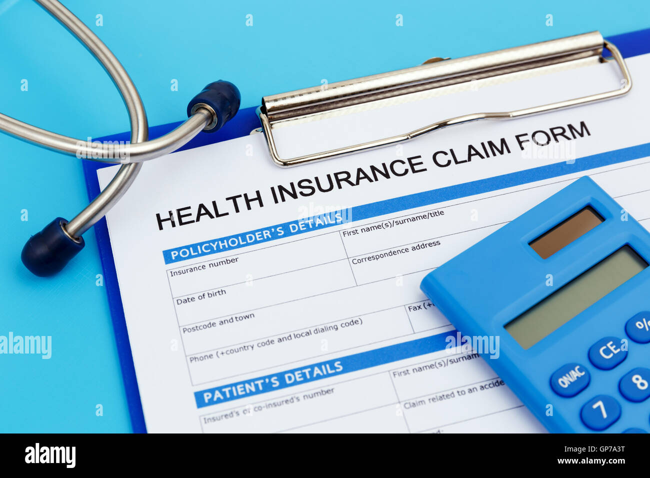 Health insurance claim form with calculator and stethoscope Stock Photo ...