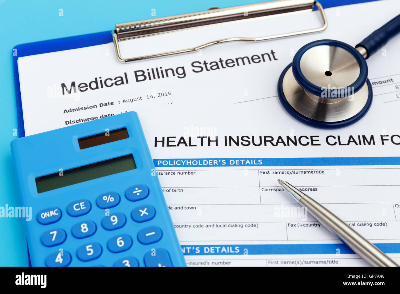 Health insurance claim form with stethoscope and calculator and pen ...