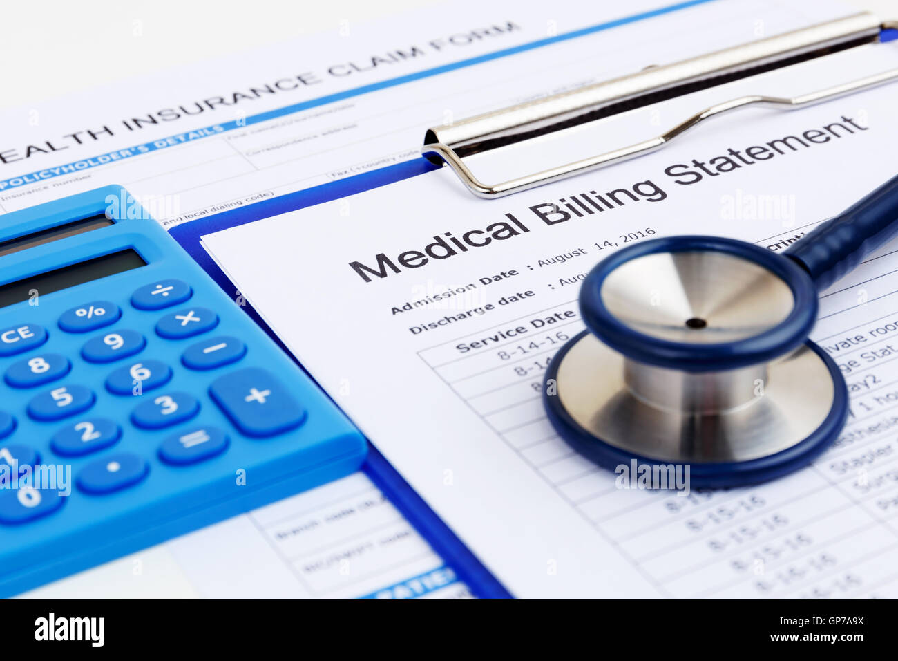 Medical bill and health insurance form with calculator Stock Photo - Alamy