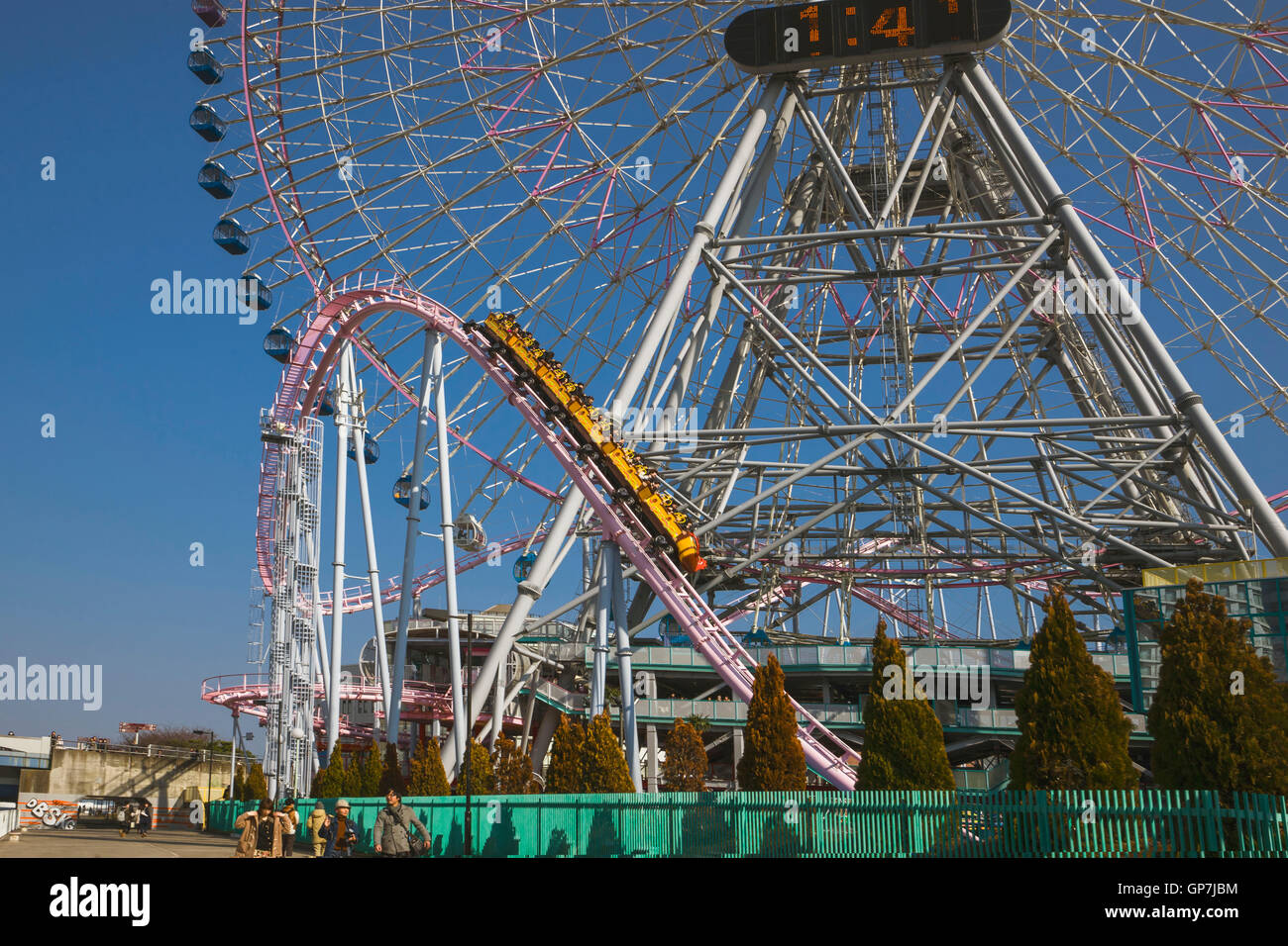 Roller coaster connected to the giant wheel in tokyo, japan Stock Photo ...