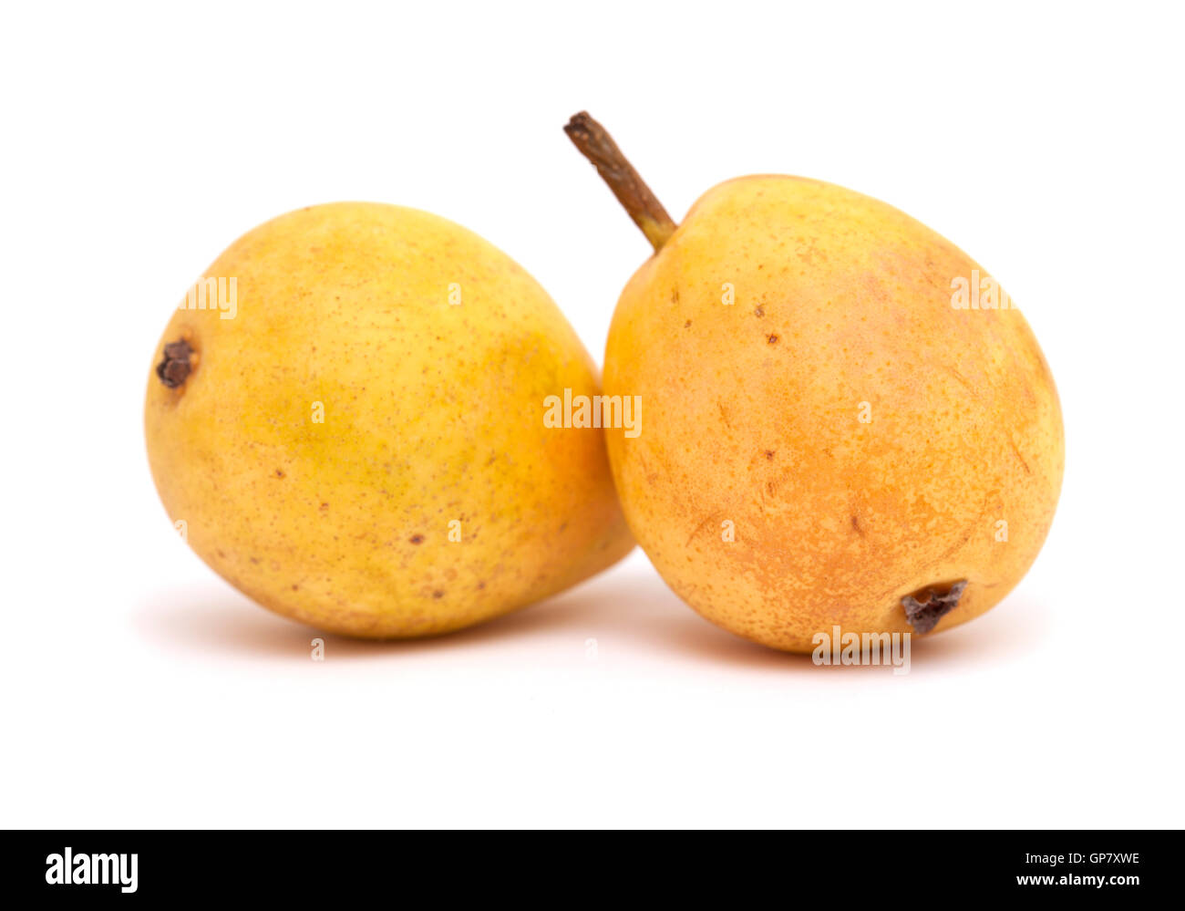 small yellow pears isolated on white background Stock Photo - Alamy