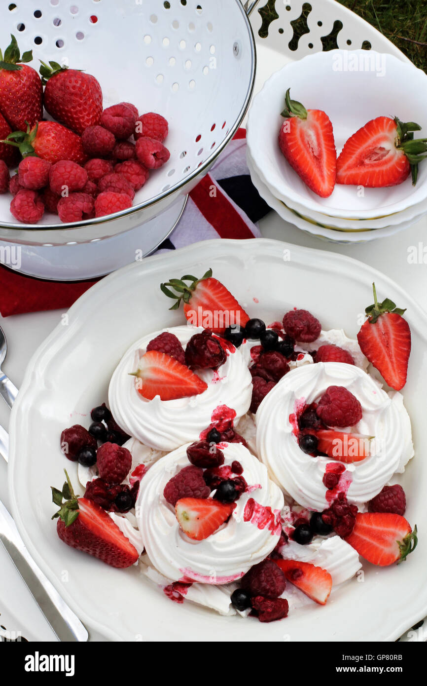 Summer berry dessert with meringues Stock Photo - Alamy