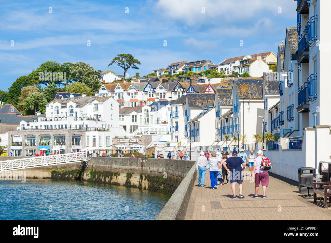 Holiday makers on Brixham Quay Brixham Devon England UK GB EU Europe ...