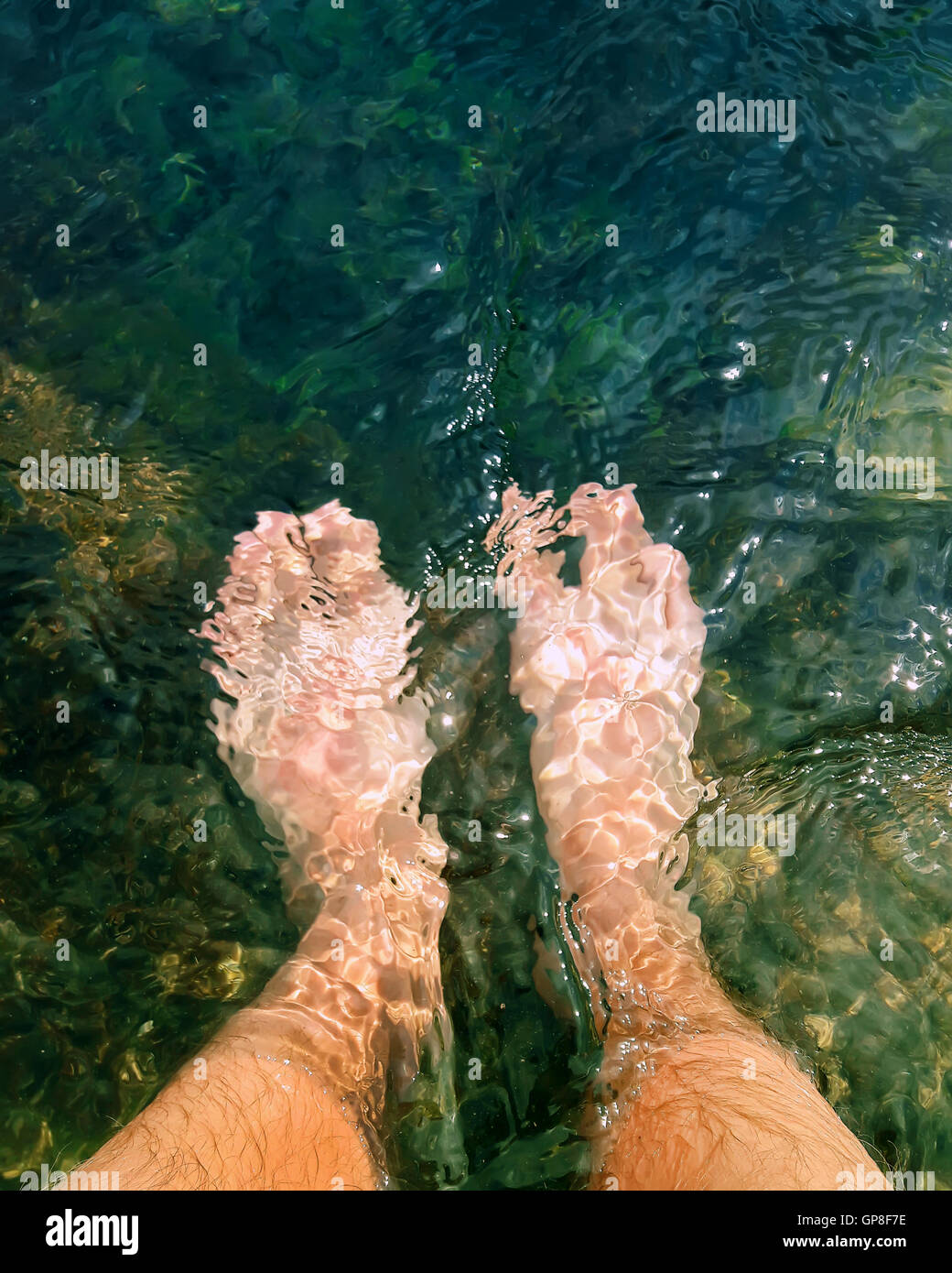 Dipping foot in water hi-res stock photography and images - Alamy