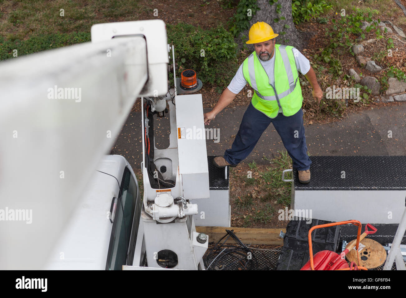High angle view of cable lineman using a lift bucket truck Stock Photo ...
