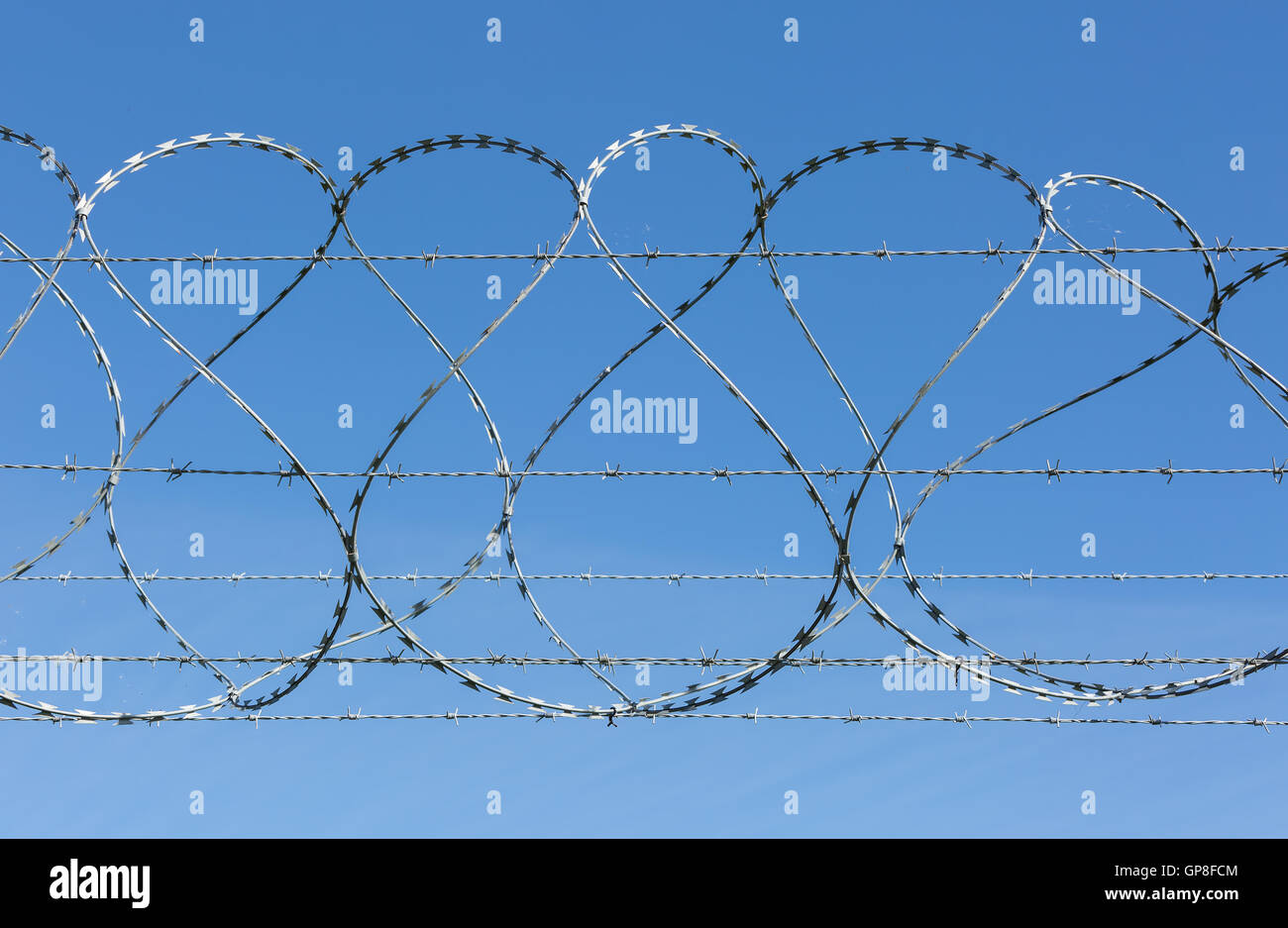 Barbed wire spiral fence hi-res stock photography and images - Alamy