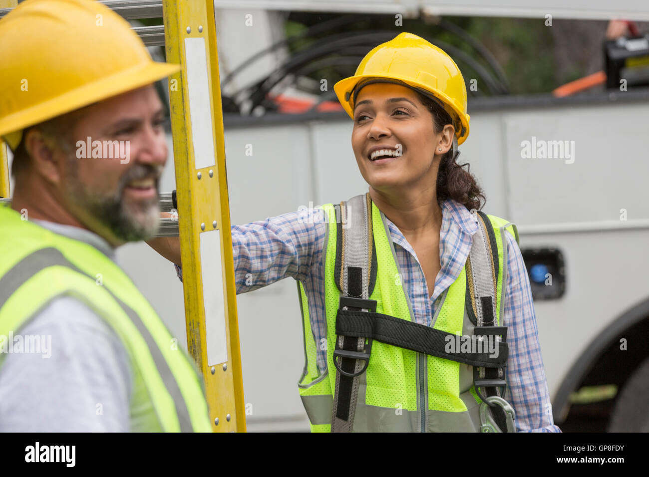 Linemen working on power lines at site Stock Photo - Alamy