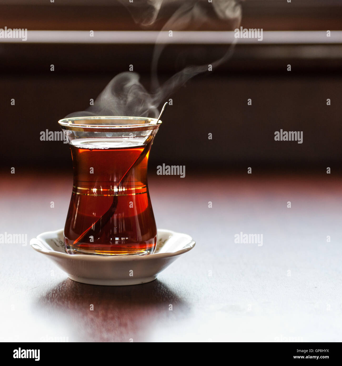 Cup of Turkish tea on a table with steam above Stock Photo - Alamy