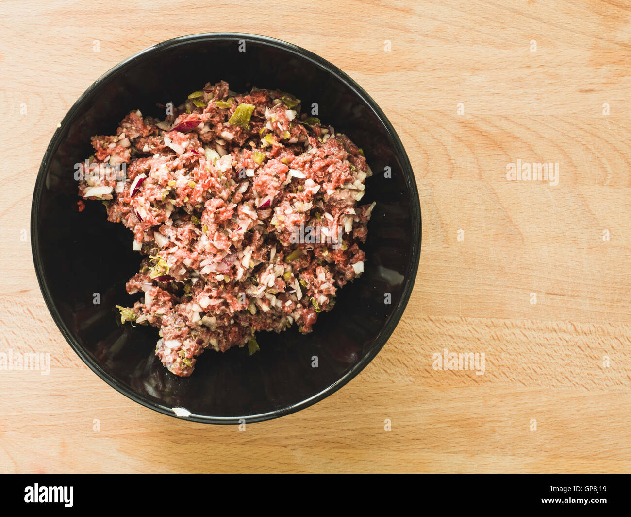 preparing a delicious raw meat dish in a restaurant Stock Photo - Alamy