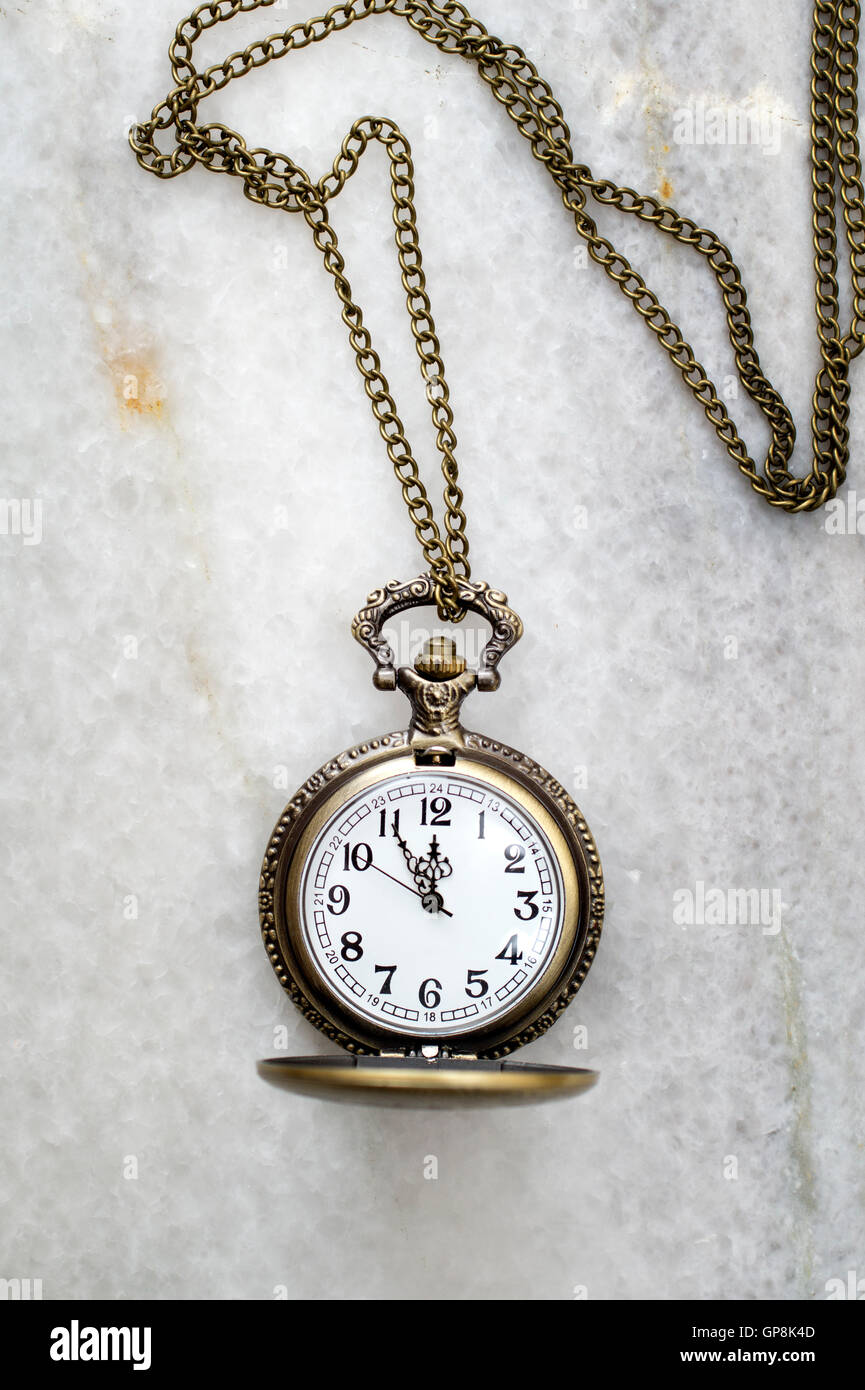 Pocket watch with chain on marble. From above Stock Photo - Alamy