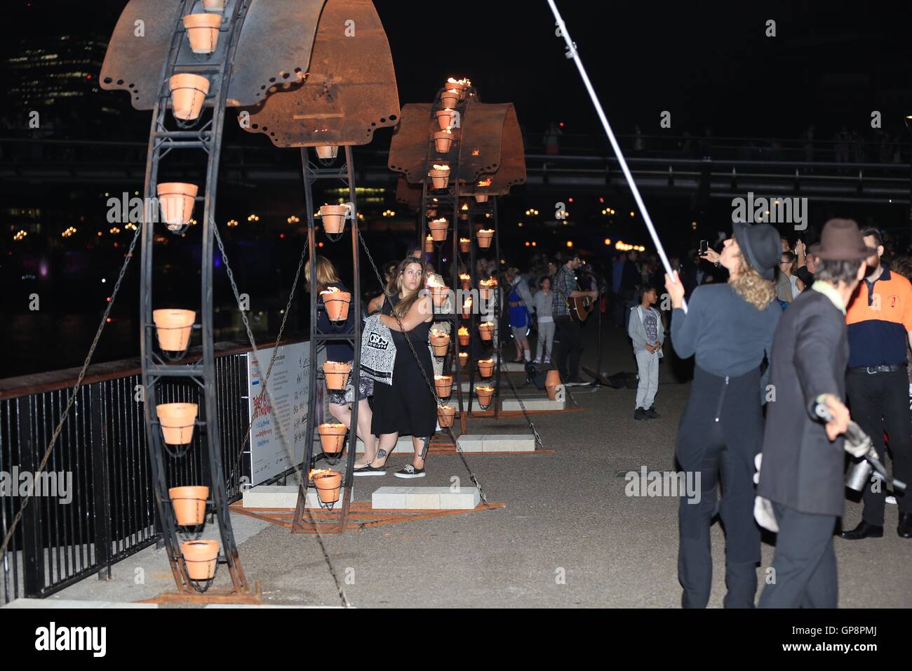 With burning metal structures, cascading candles and flickering ...