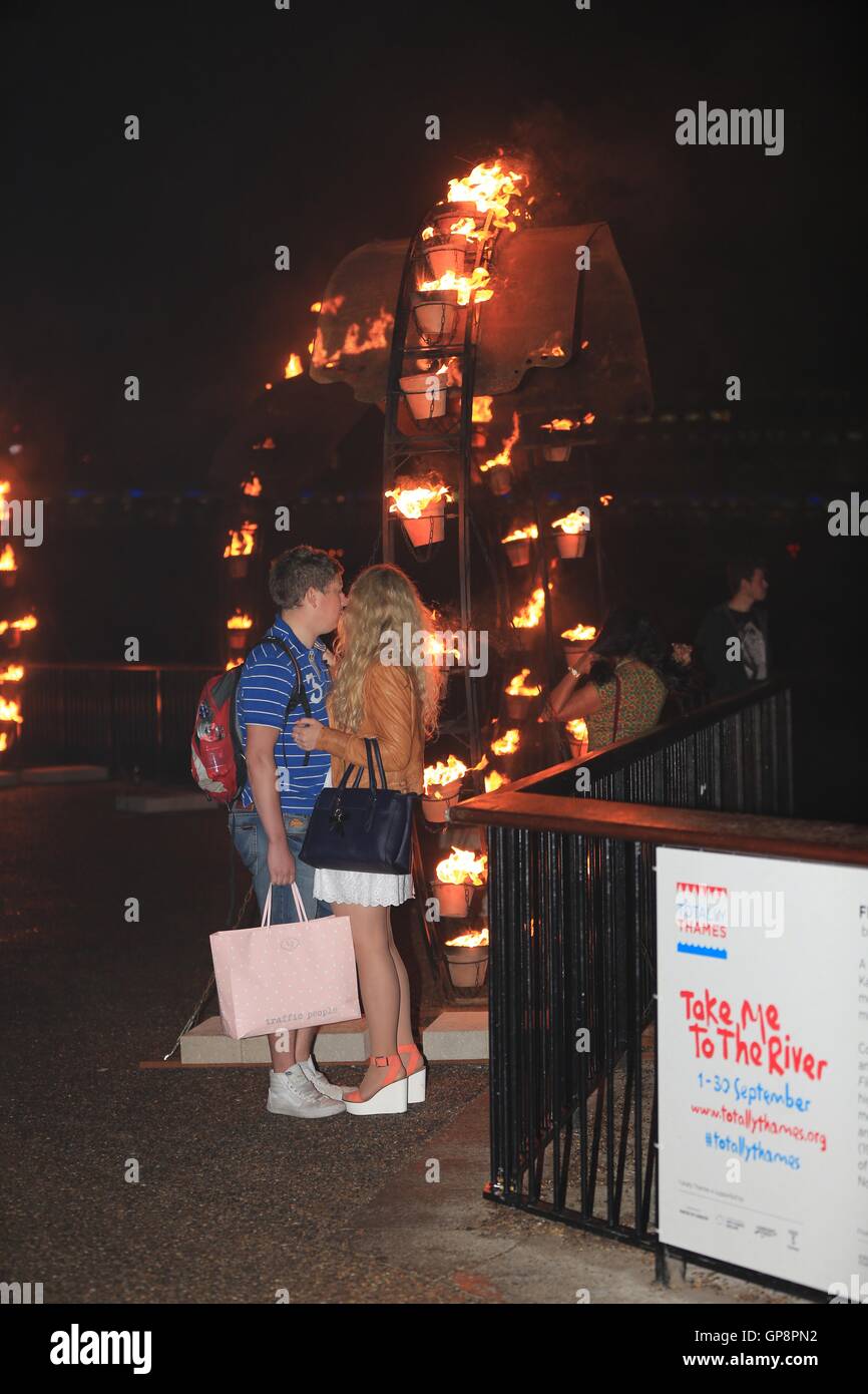 With burning metal structures, cascading candles and flickering ...