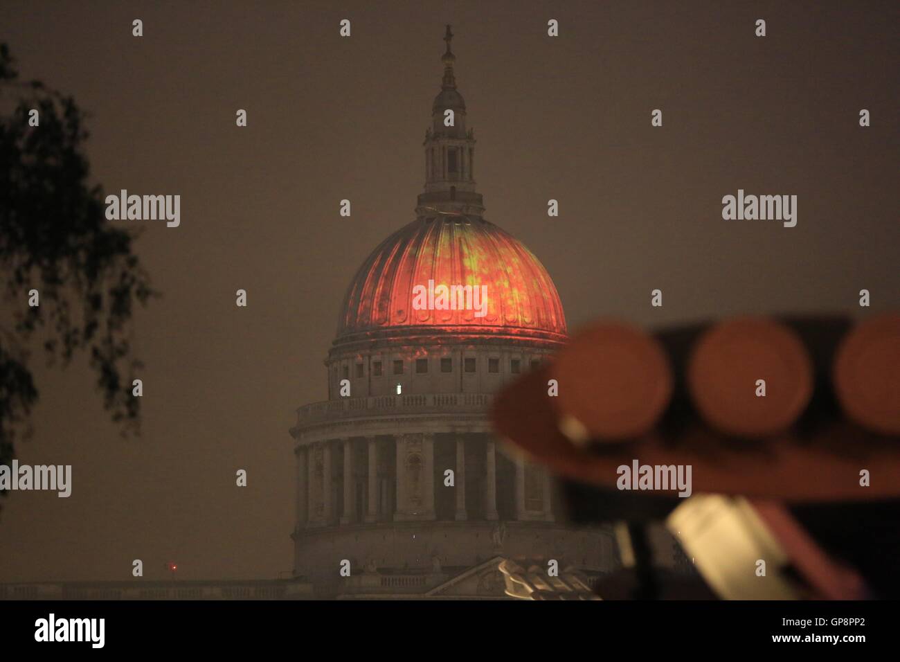 With burning metal structures, cascading candles and flickering ...