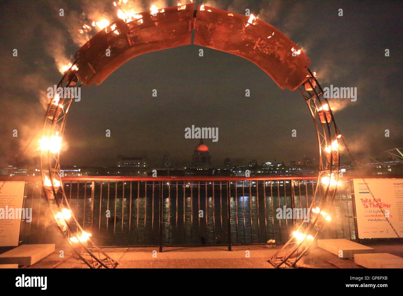 With burning metal structures, cascading candles and flickering ...