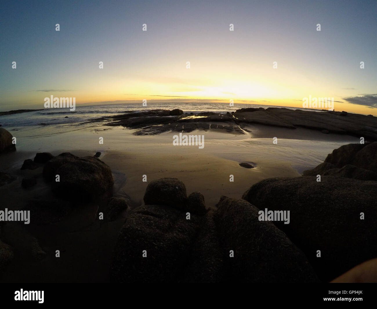 Sunset on the beach Stock Photo - Alamy