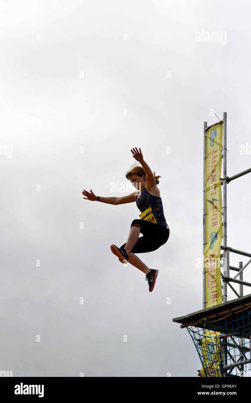 Person jumping off of a 5m high platform and in to an airbag as part of ...