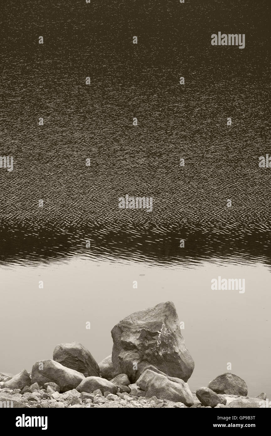 Scottish landscape with loch and rocks on a rainy day. Vertical Stock ...