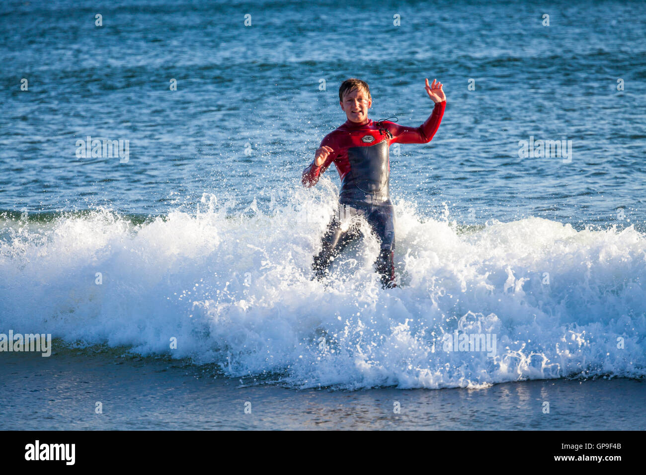 Surfer in West Wales, UK Stock Photo - Alamy