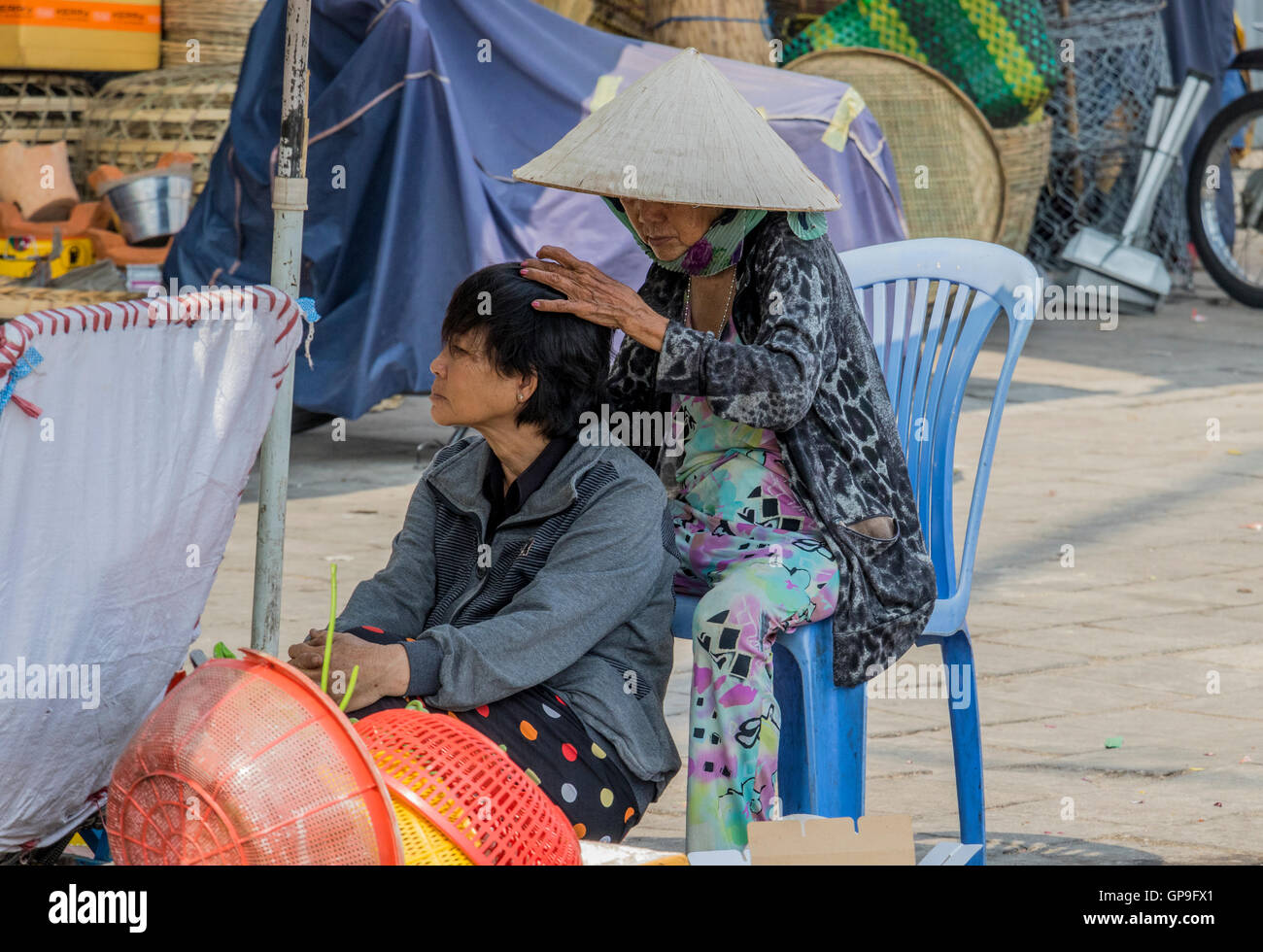 Lady grooming another ladies hair in Ho Chi Minh city Vietnam Stock ...