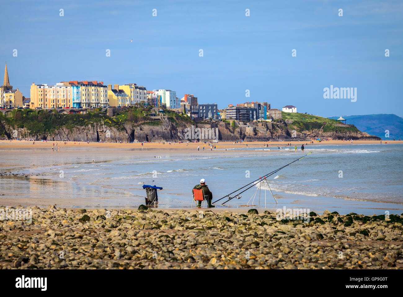 Fishing on Tenby South Beach Stock Photo - Alamy