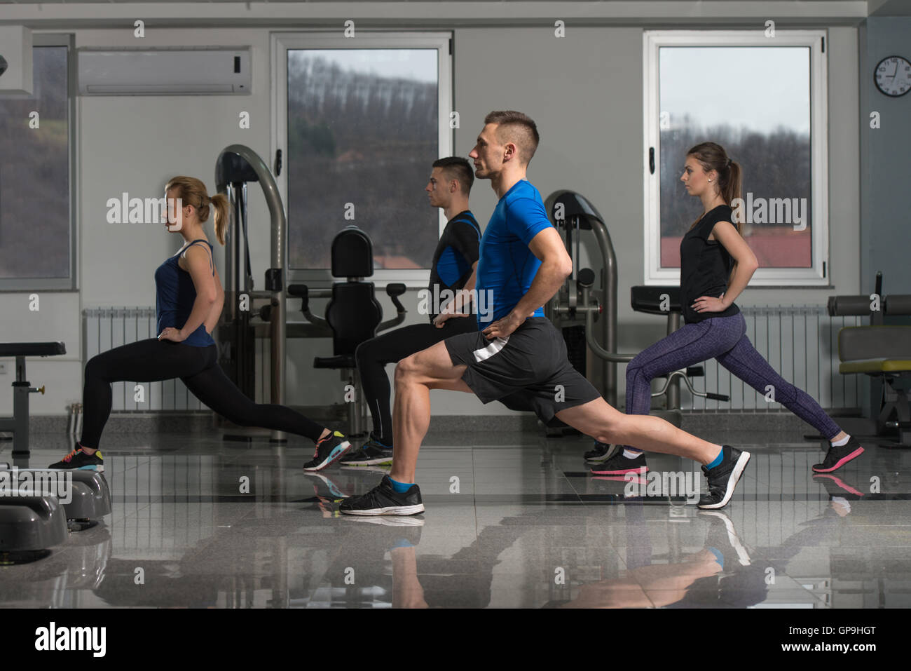 Group Of Friends Exercising Together During A Gym Class Stock Photo - Alamy
