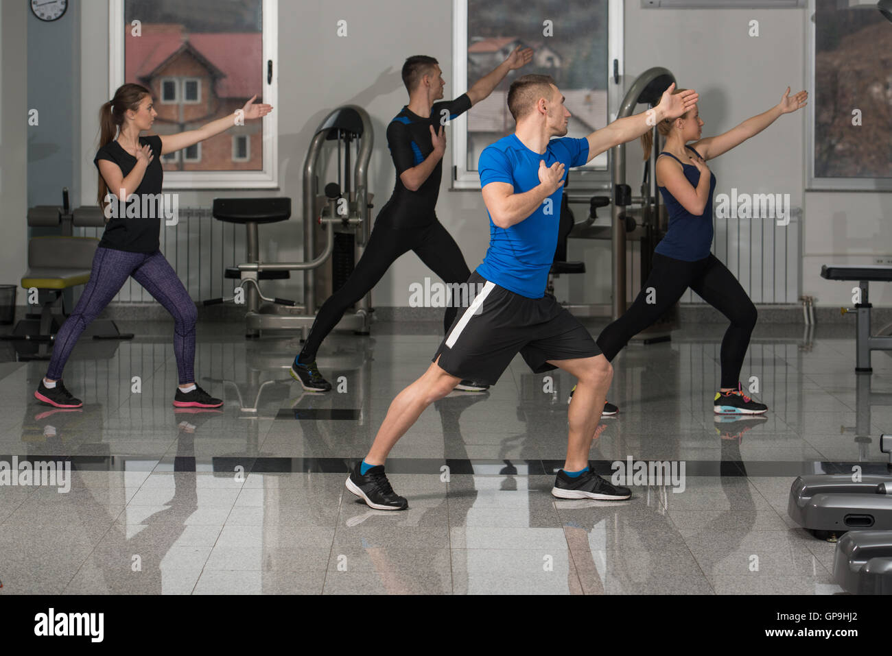 Group Of Friends Exercising Together During A Gym Class Stock Photo - Alamy