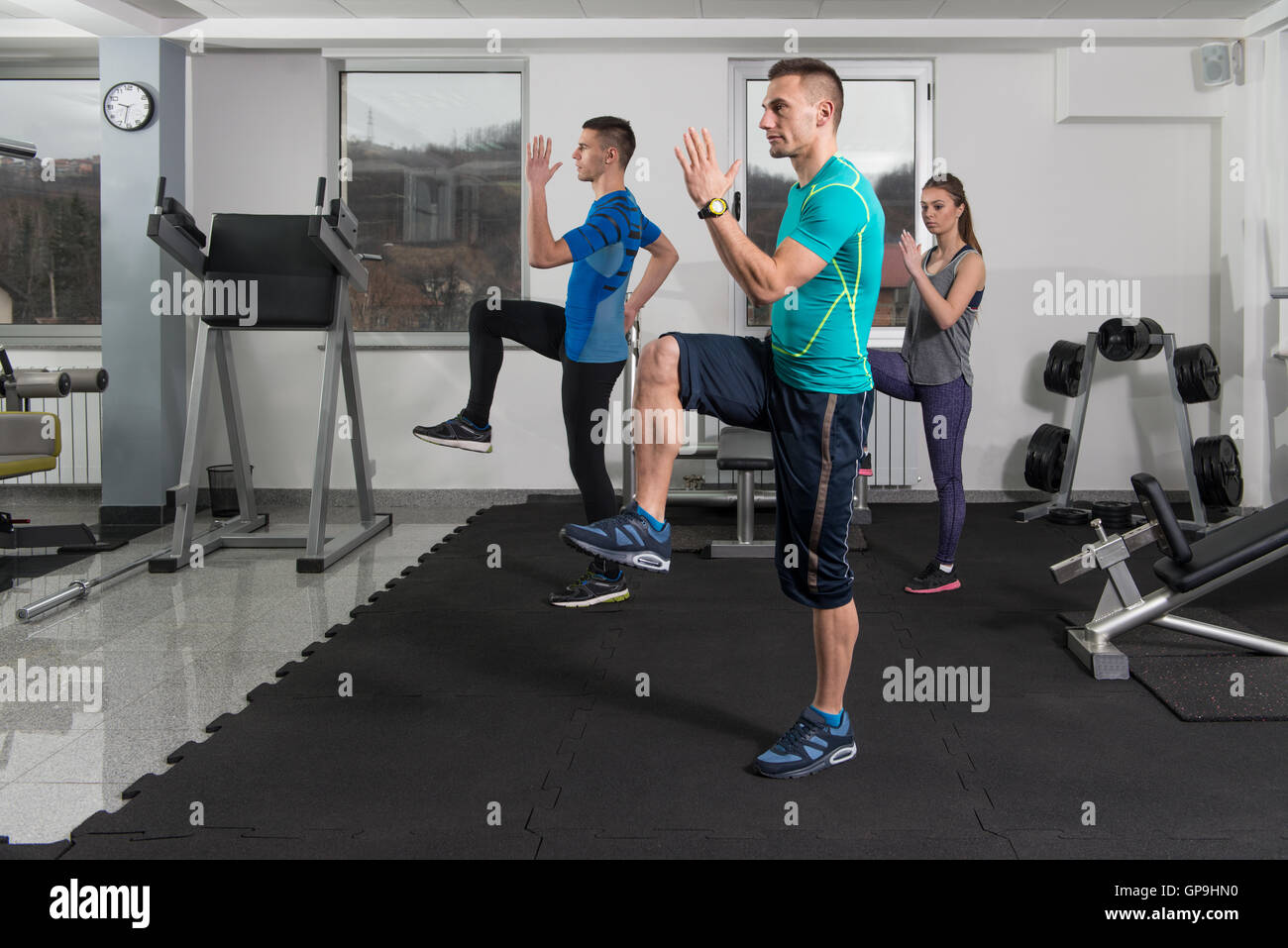Group Of Friends Exercising Together During A Gym Class Stock Photo - Alamy