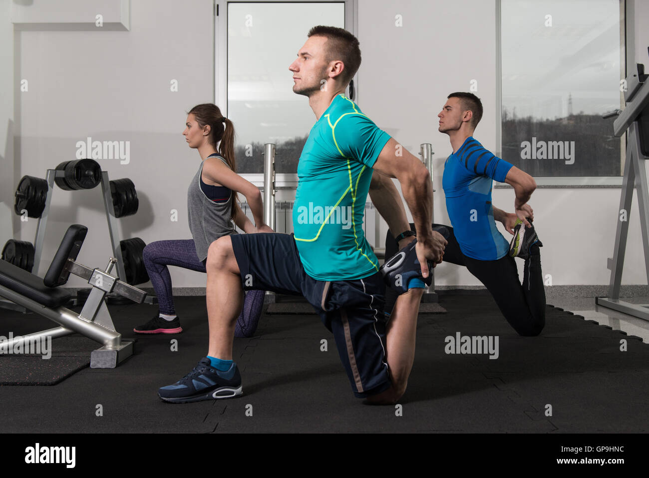 Group Of People At The Gym In A Stretching Class Stock Photo - Alamy