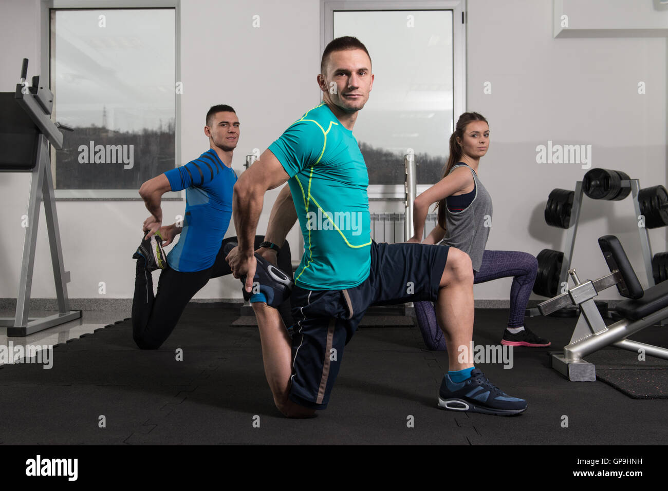 Group Of Friends Exercising Together During A Gym Class Stock Photo - Alamy
