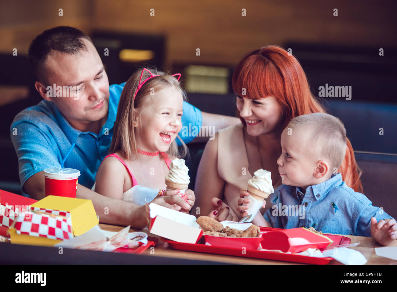 Family Eating At Fast Food Restaurant