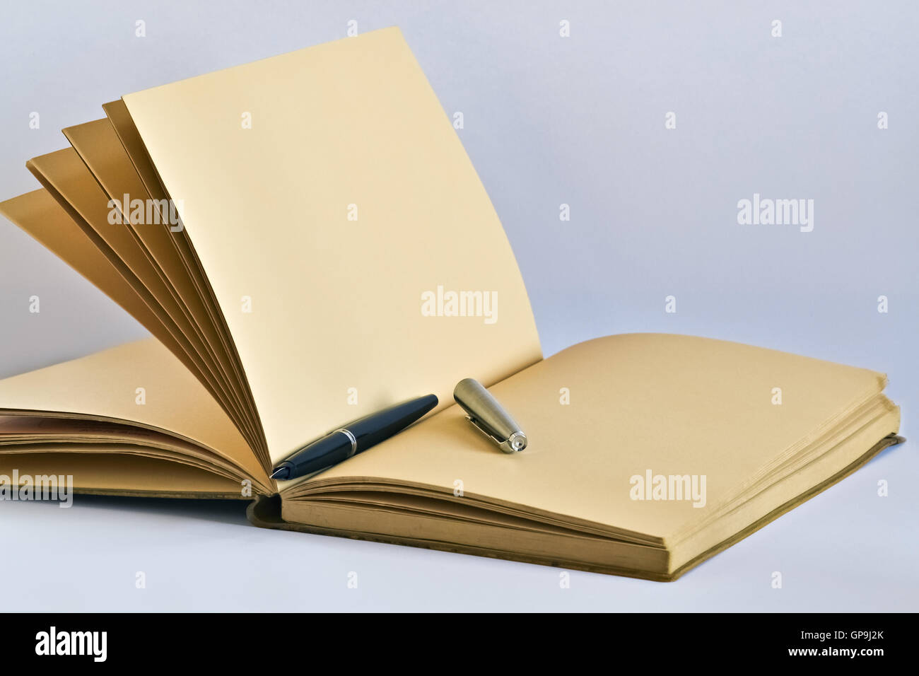 Open blank page and fountain pen on bright background Stock Photo - Alamy