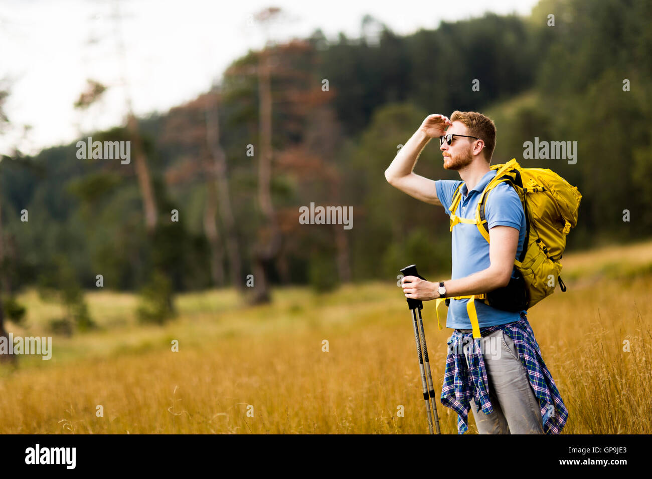 Man walking outdoors on sunny hi-res stock photography and images - Alamy