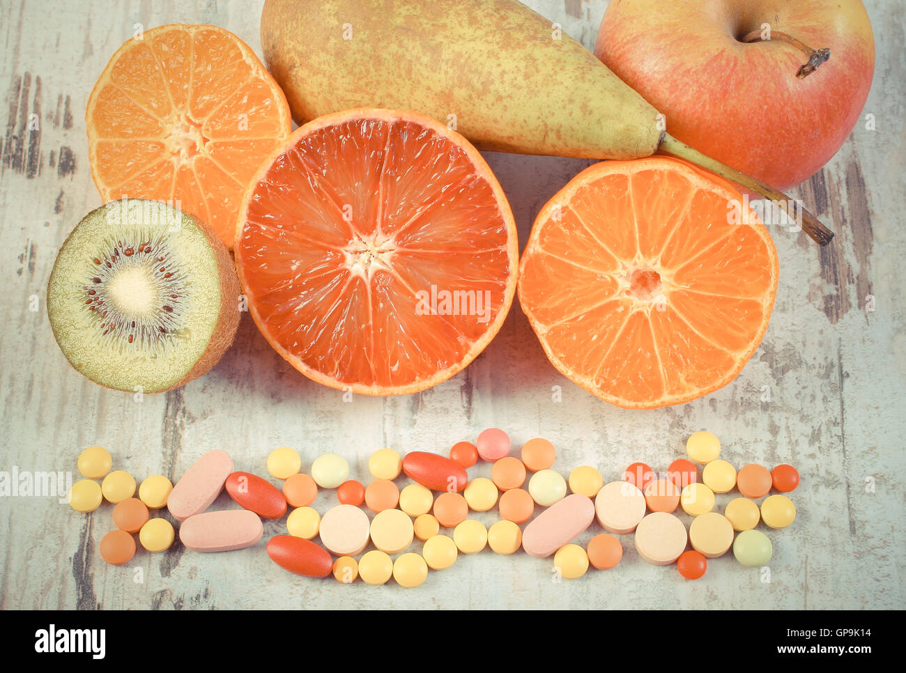 Vintage photo, Fresh natural fruits with medical pills, tablets and ...